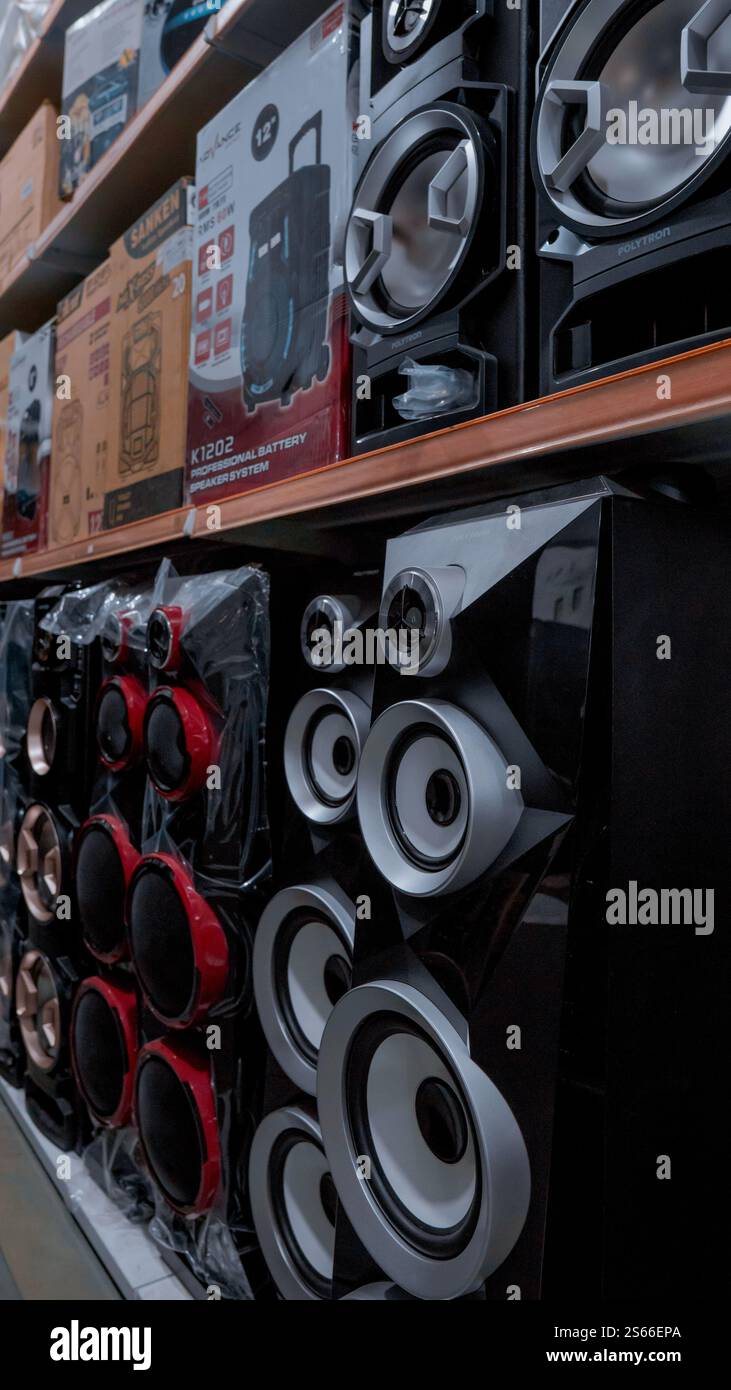 A display of various portable speakers and sound systems on a store ...