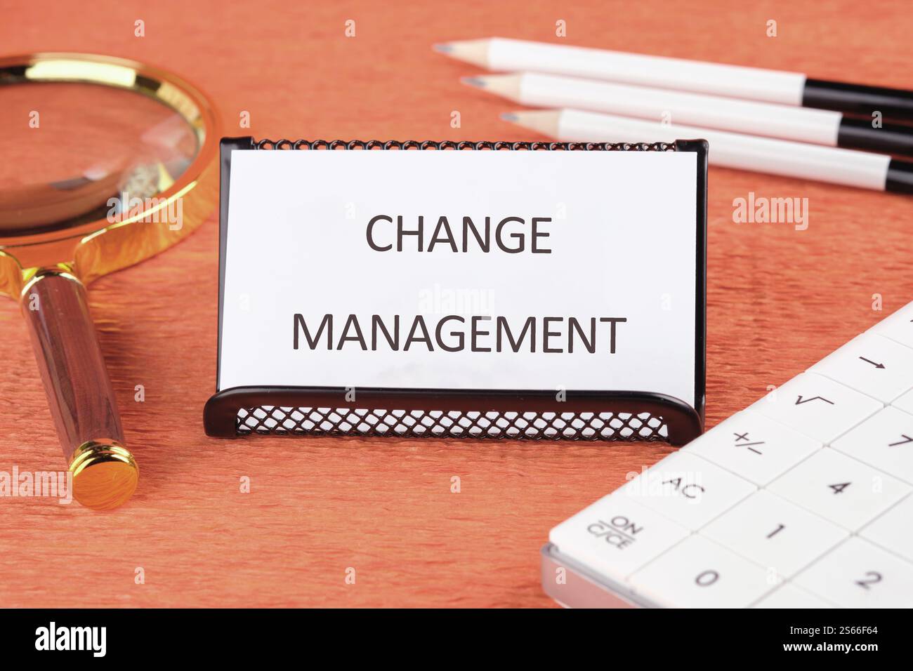 The conceptual phrase CHANGE MANAGEMENT written on a business card ...