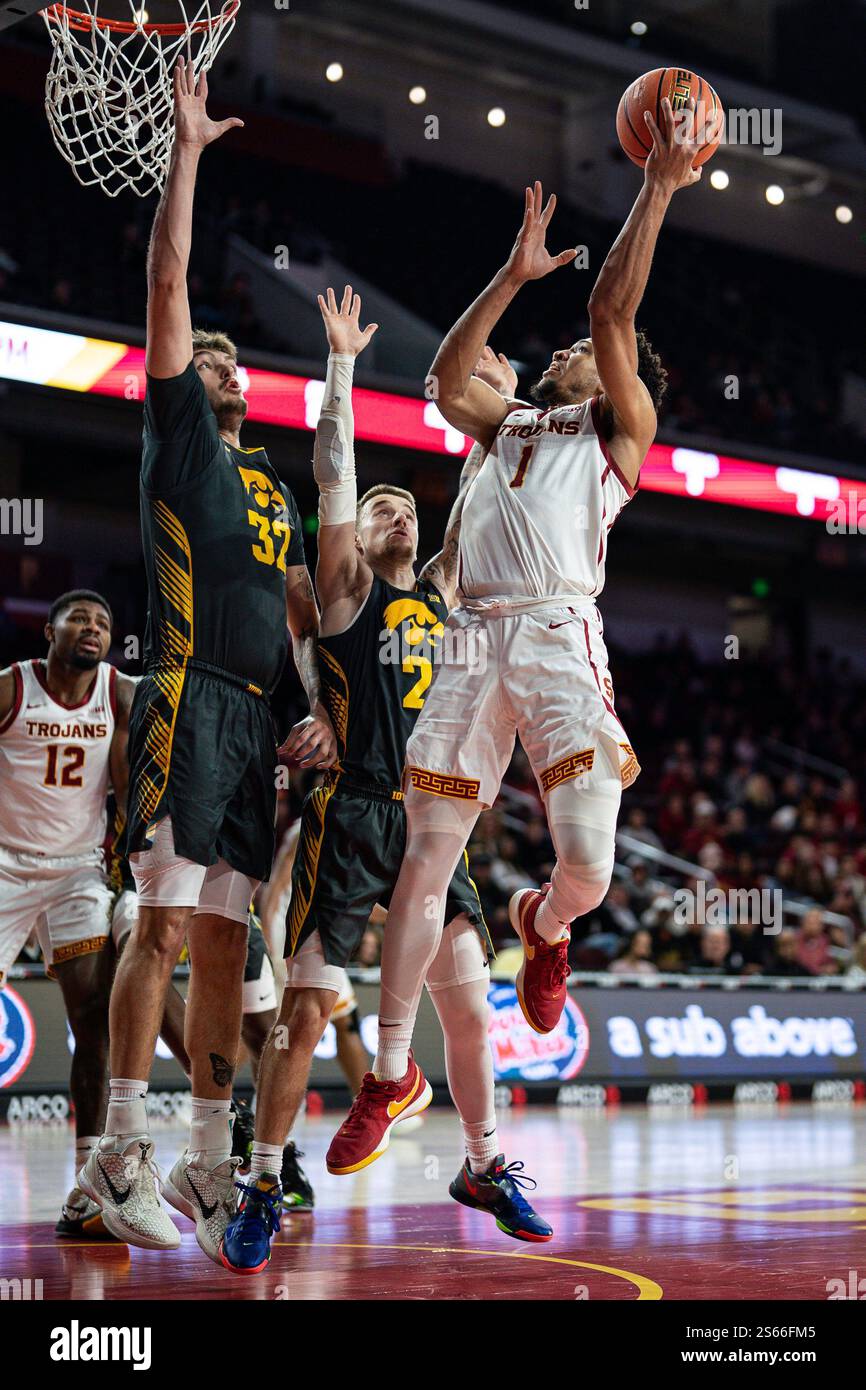 USC Trojans guard Desmond Claude (1) shoots over Iowa Hawkeyes forward ...