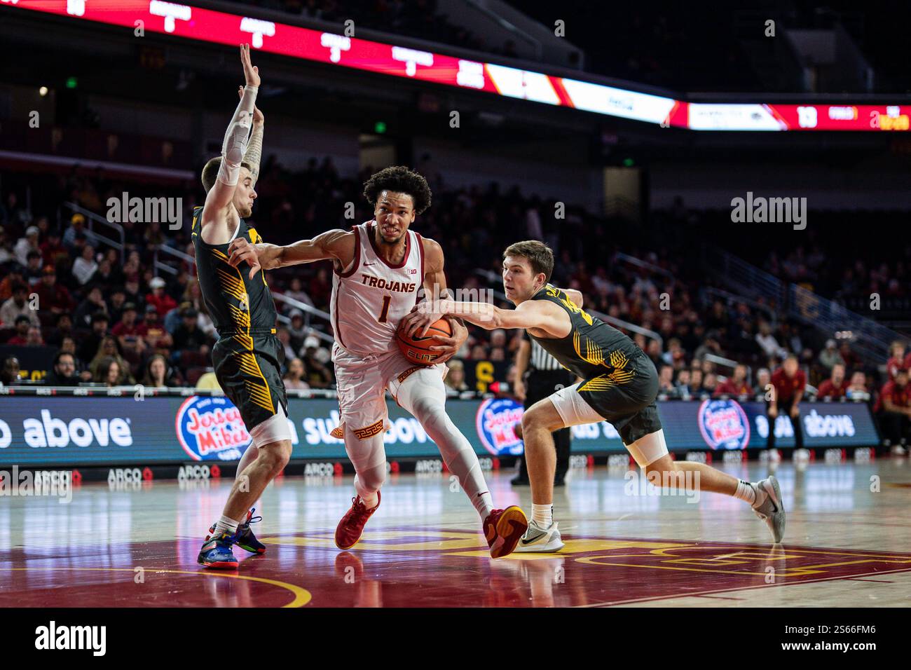 USC Trojans guard Desmond Claude (1) drives against Iowa Hawkeyes guard ...