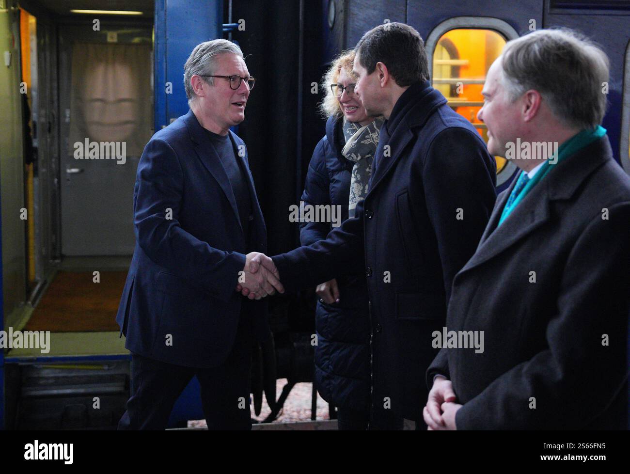British Prime Minister Keir Starmer, left, is greeted by Ukrainian ...