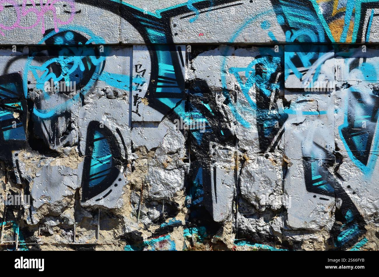 Fragment of an old colored graffiti drawing on the wall. Background ...