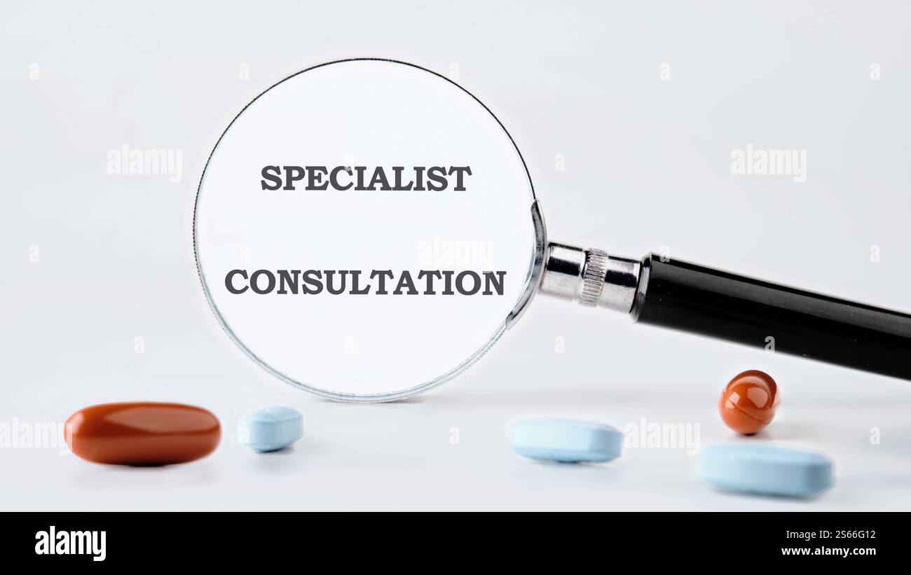 Magnifying glass highlights the words specialist consultation ...