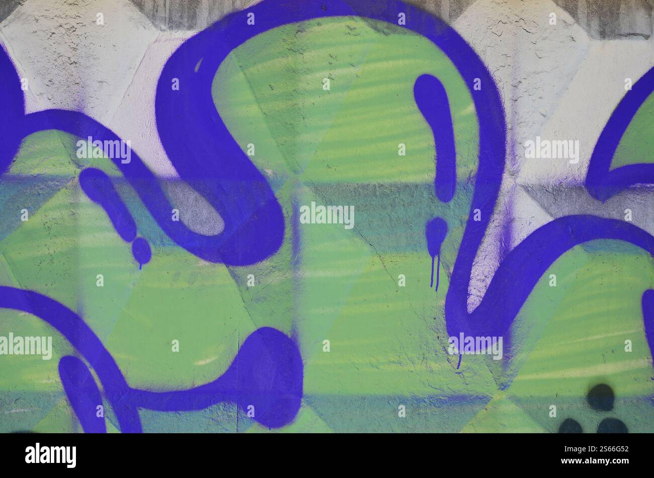 Fragment of an old colored graffiti drawing on the wall. Background ...