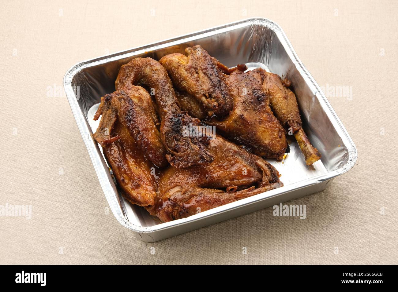 Ayam Bakar, roasted chicken with herbs and spice. Served with chilli ...