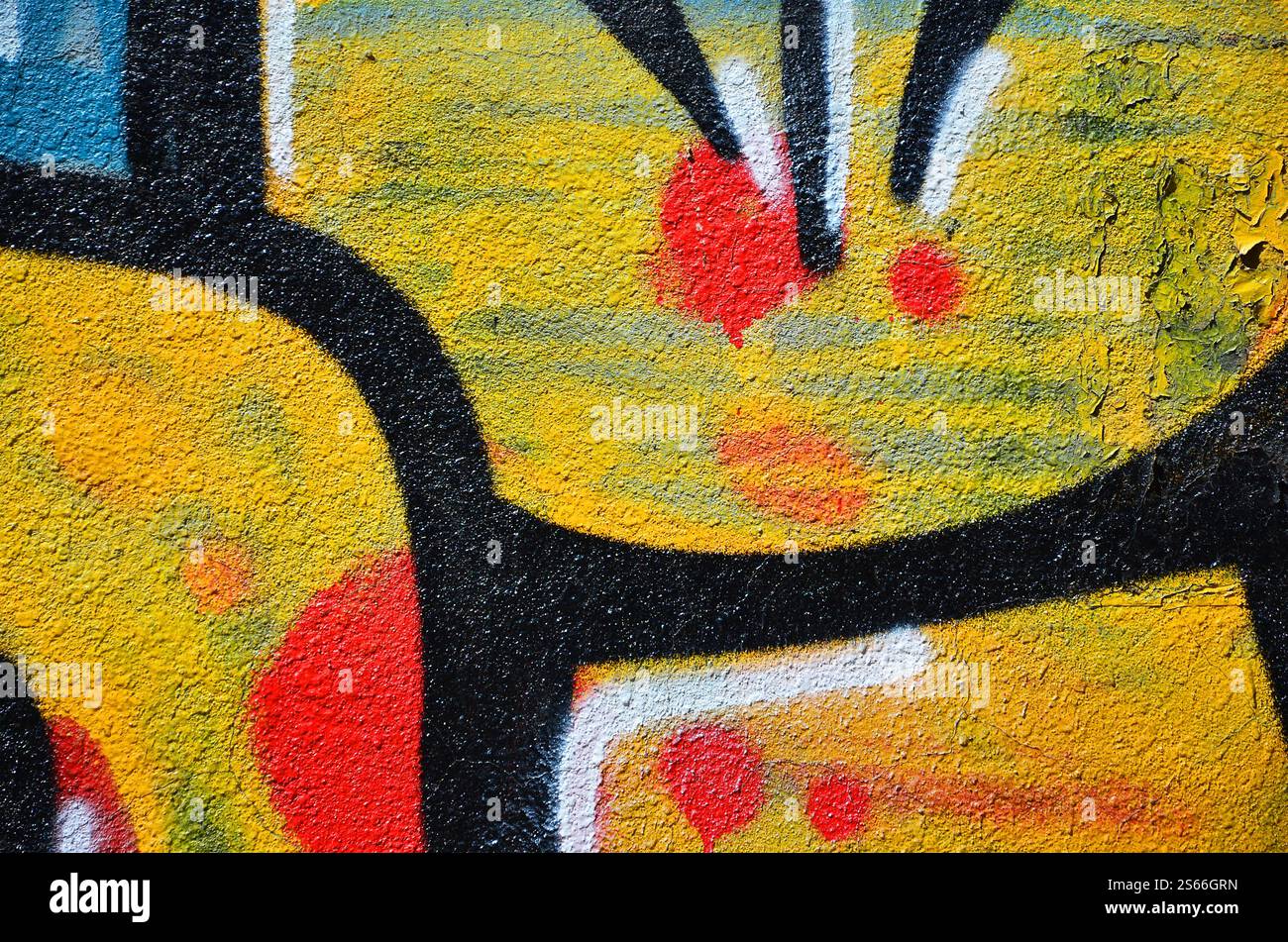 Fragment of an old colored graffiti drawing on the wall. Background ...