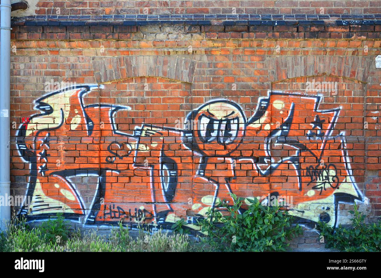 Fragment of an old colored graffiti drawing on the wall. Background ...