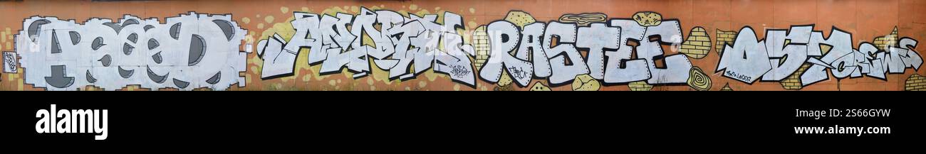 A photo of several graffiti artworks on the metal wall. Graffiti ...