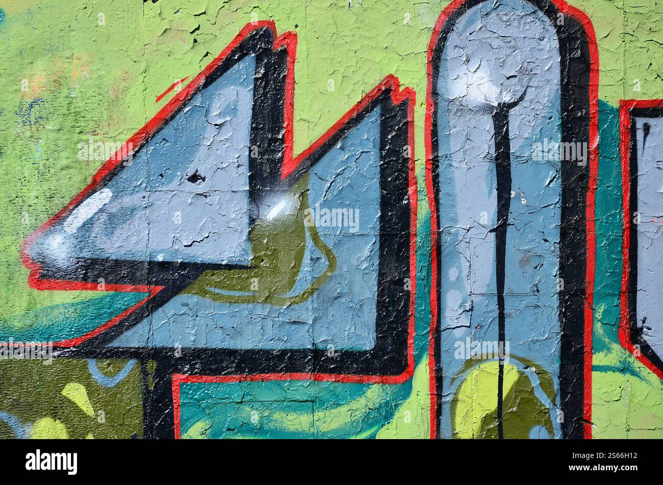 Fragment of an old colored graffiti drawing on the wall. Background ...