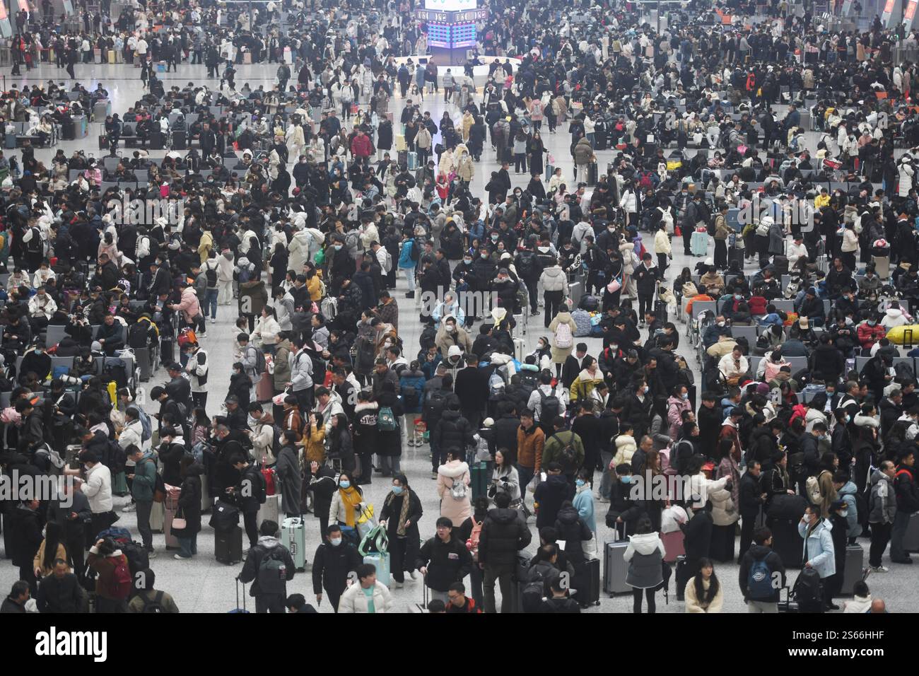 Travelers are seen in Hangzhoudong Railway Station, Hangzhou City, east ...