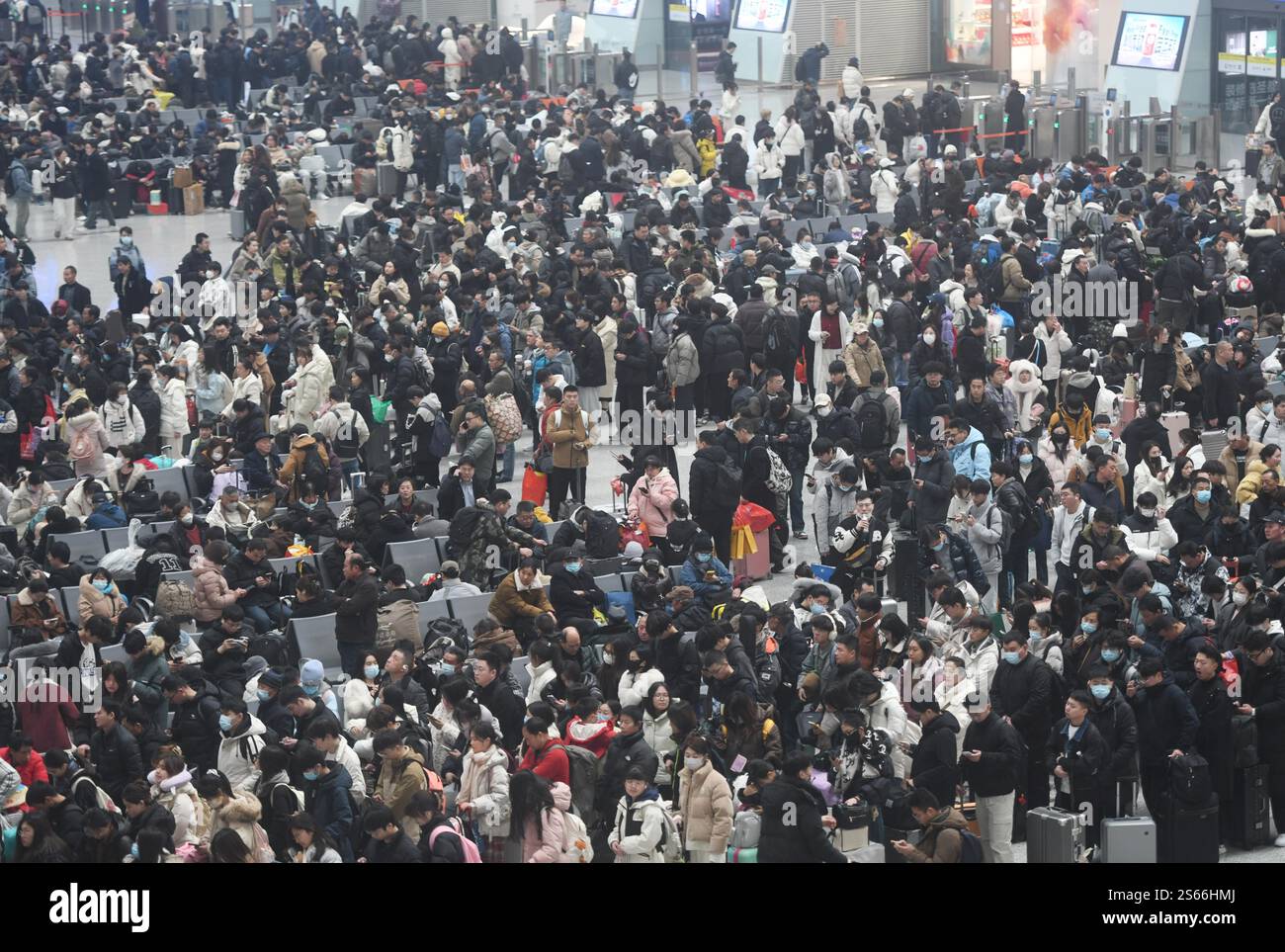 Travelers are seen in Hangzhoudong Railway Station, Hangzhou City, east ...