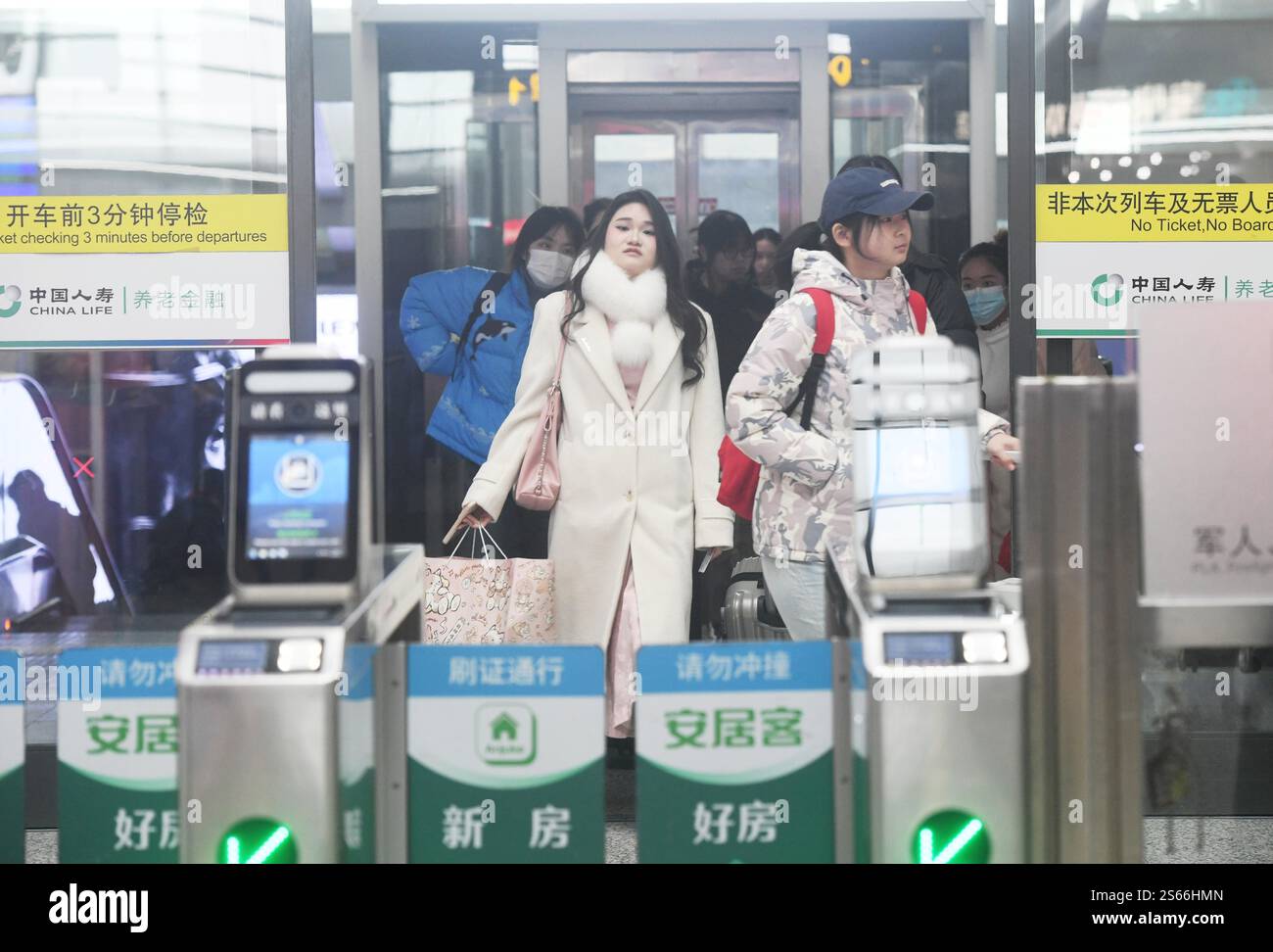 Travelers are seen in Hangzhoudong Railway Station, Hangzhou City, east ...