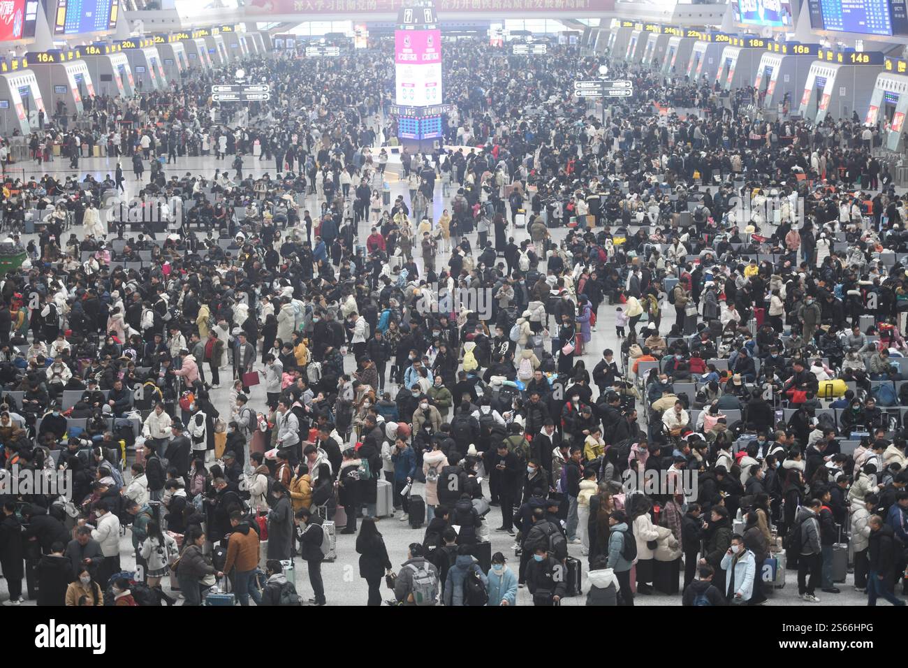 Travelers are seen in Hangzhoudong Railway Station, Hangzhou City, east ...