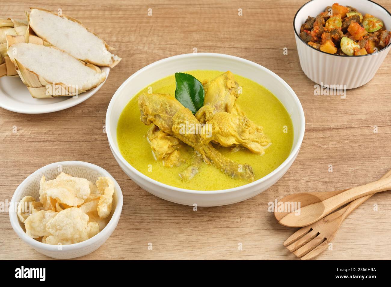 Opor Ayam, served with ketupat, sambal goreng ati, keripik kentang and ...