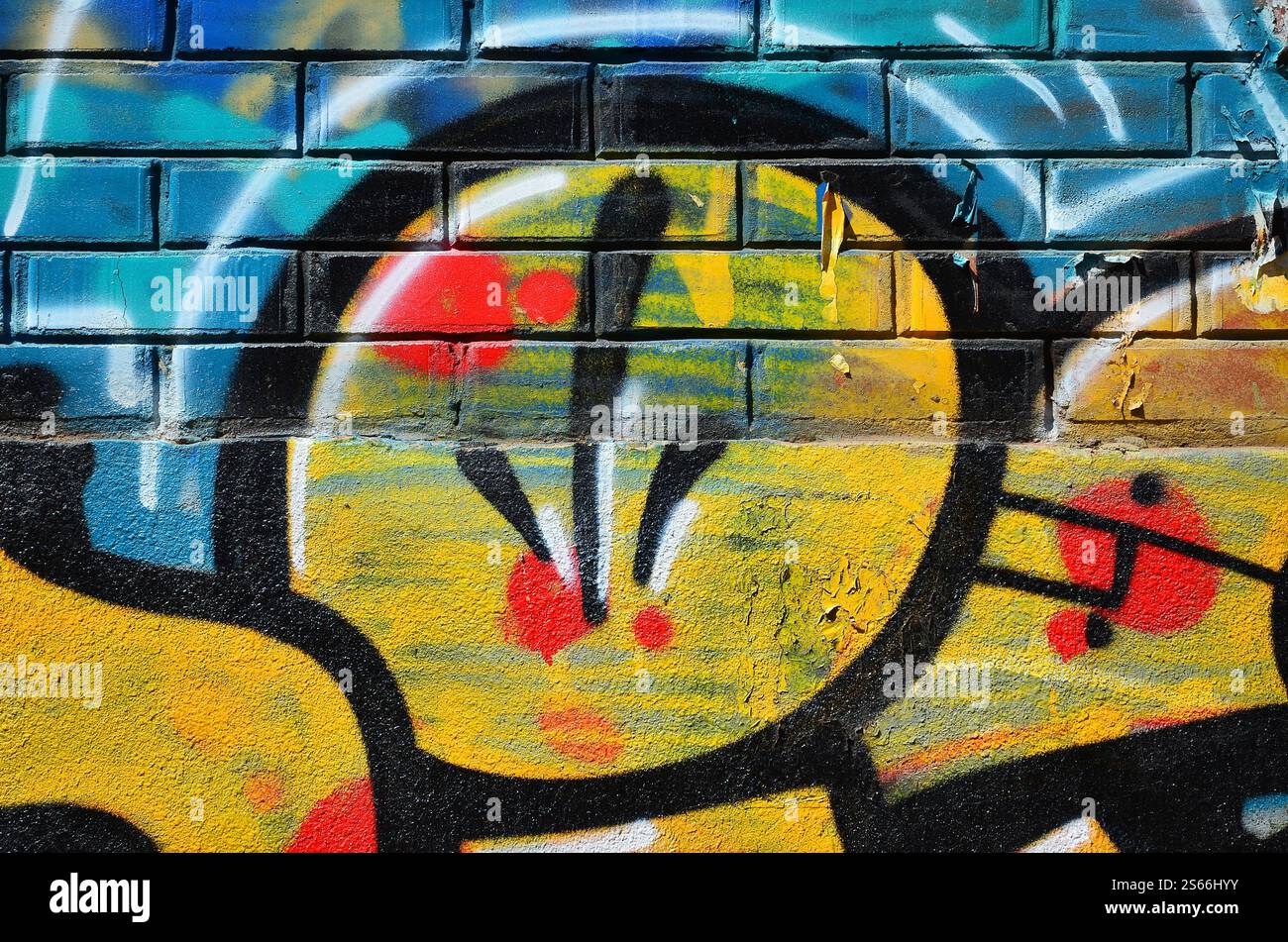 Fragment of an old colored graffiti drawing on the wall. Background ...