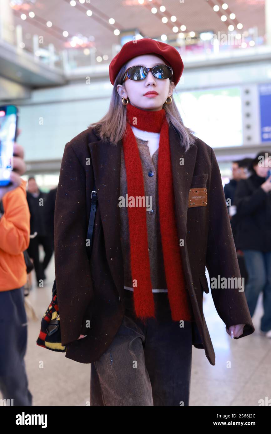 Chinese singer and actress Meng Meiqi appears at the airport in Beijing ...