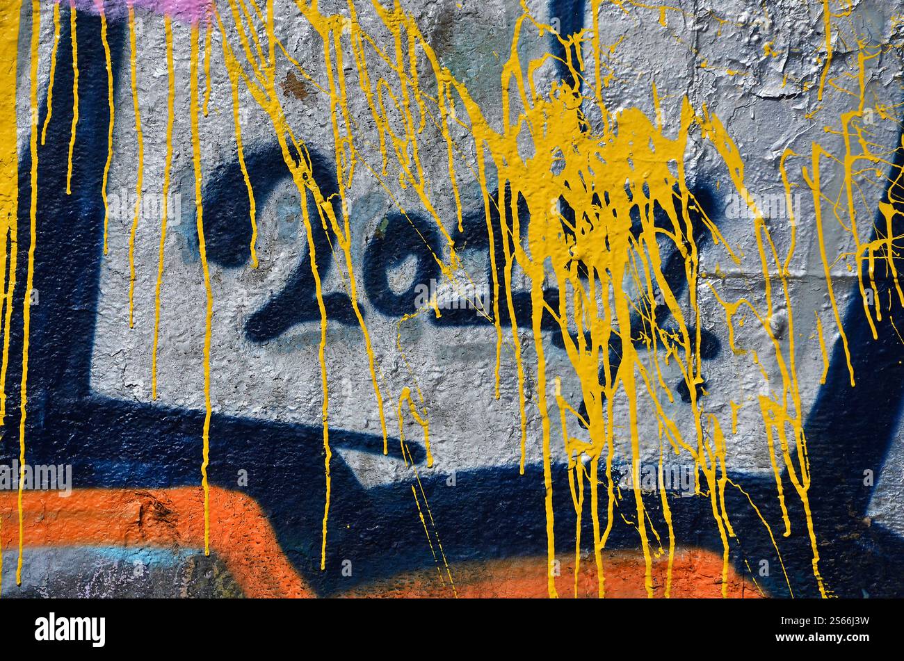 Fragment of an old colored graffiti drawing on the wall. Background ...