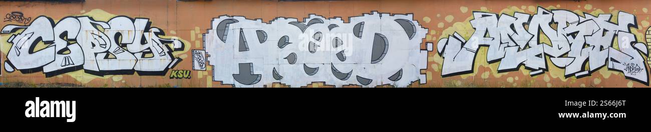 A photo of several graffiti artworks on the metal wall. Graffiti ...