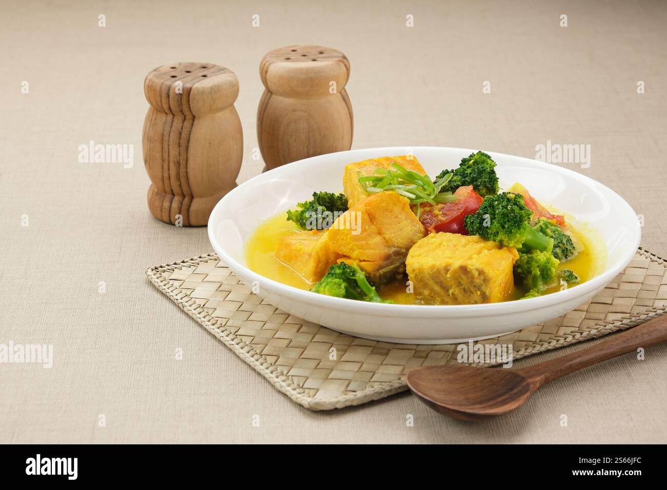 Salmon Kuah Kuning, fish soup with broccoli and tomatoes. Indonesian ...