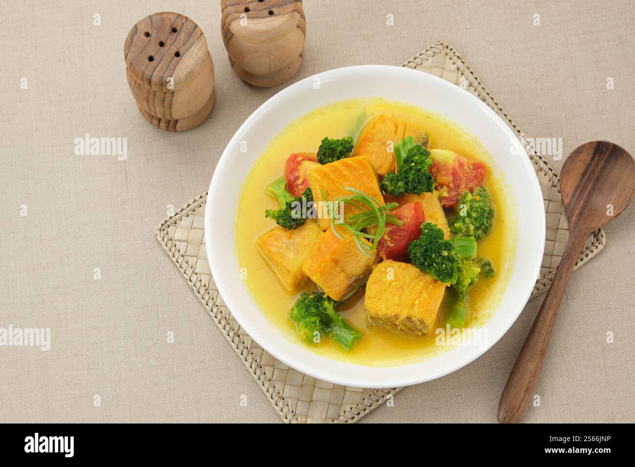 Salmon Kuah Kuning, fish soup with broccoli and tomatoes. Indonesian ...