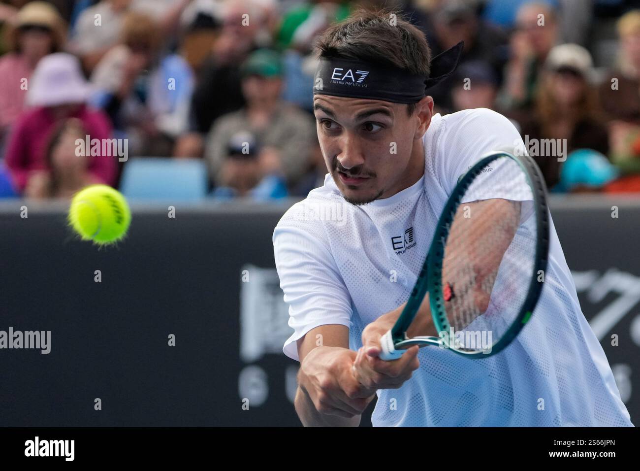 Lorenzo Sonego of Italy plays a backhand return to Joao Fonseca of Brazil during their second ...