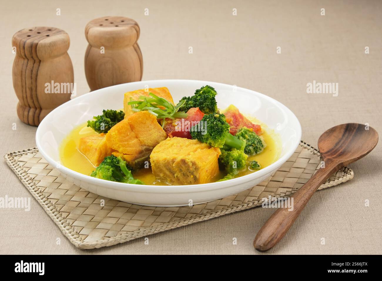 Salmon Kuah Kuning, fish soup with broccoli and tomatoes. Indonesian ...