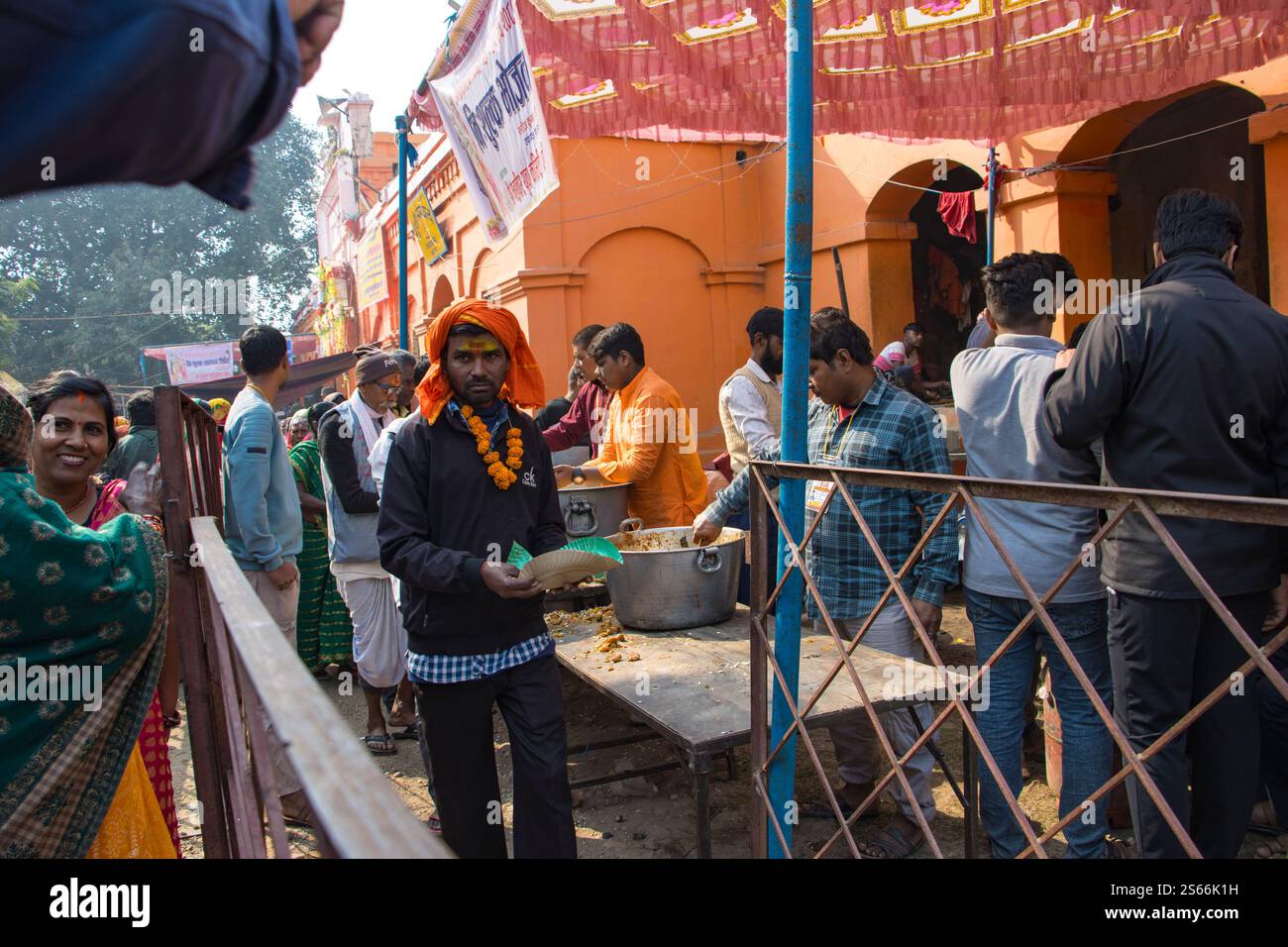 Pilgrims line up for the free food called Bhandara on the Bibaha ...