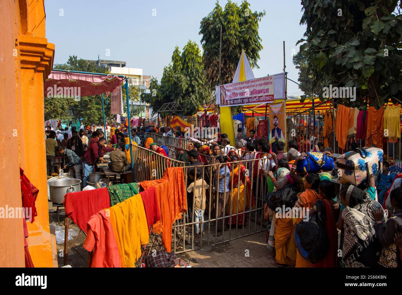 Pilgrims line up for the free food called Bhandara on the Bibaha ...