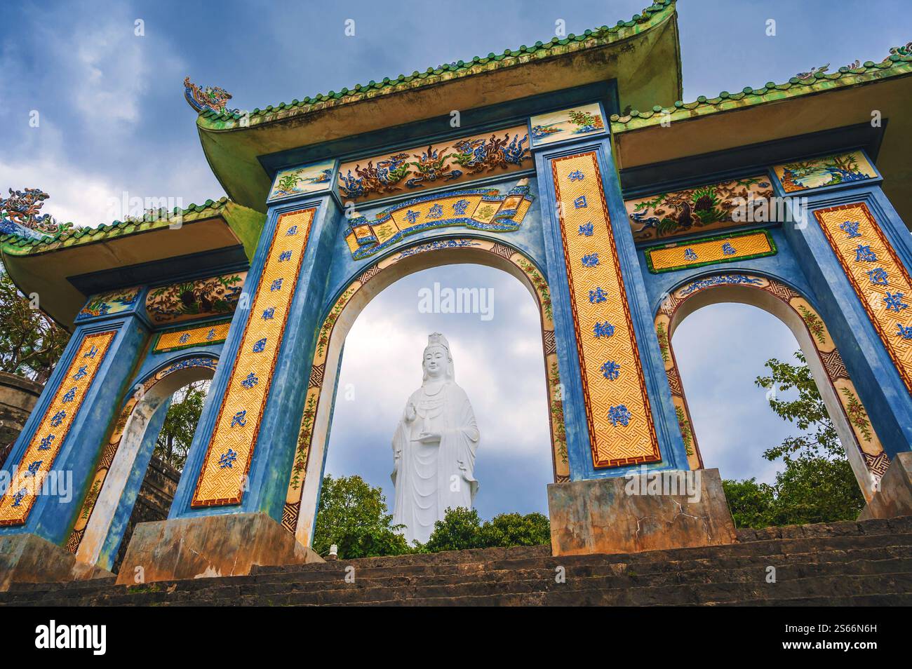 Beautiful Gate of Linh ung Pagoda and White Lady Buddha with blue sky ...