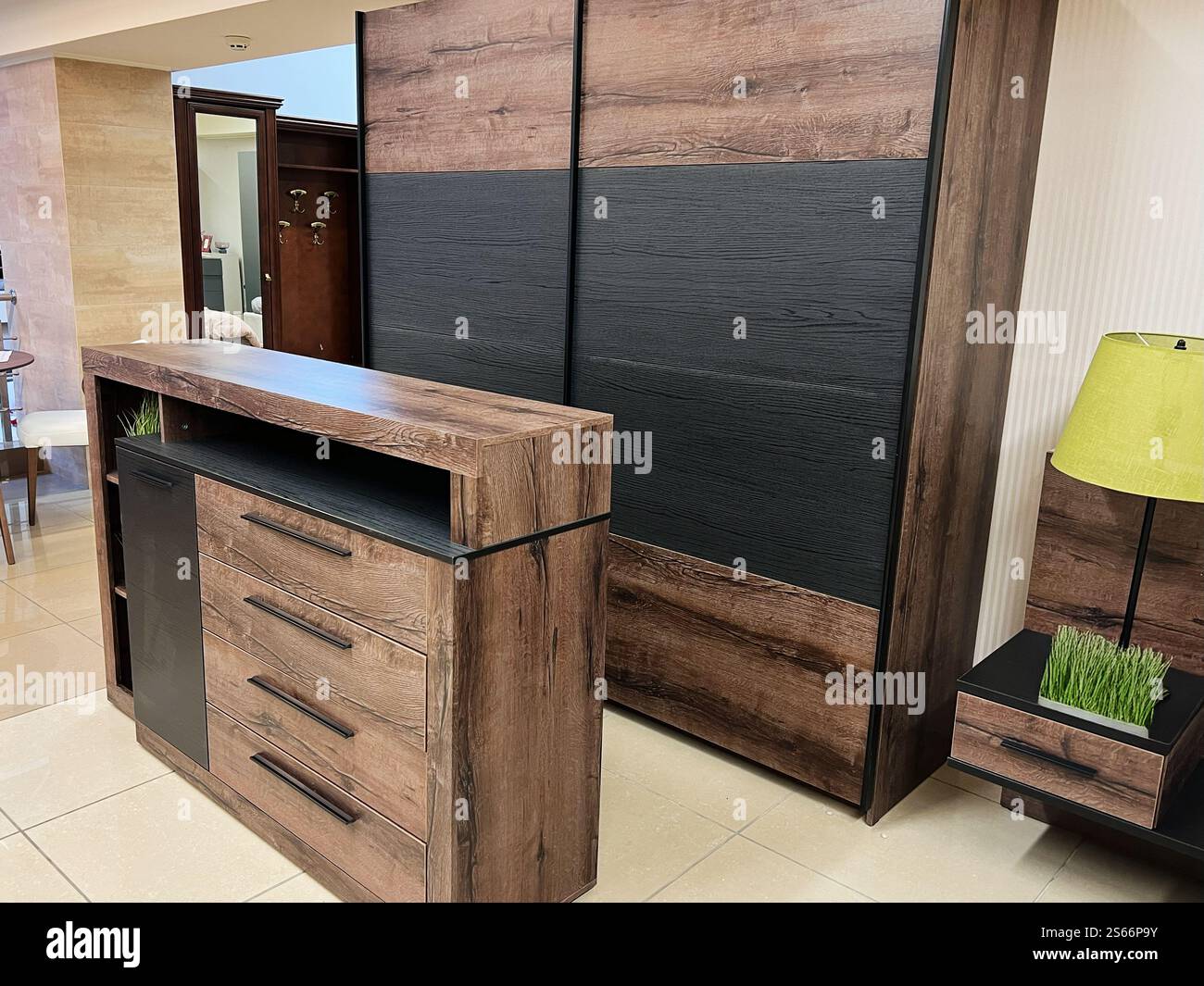 A contemporary furniture setup featuring a wardrobe, cabinet, and ...
