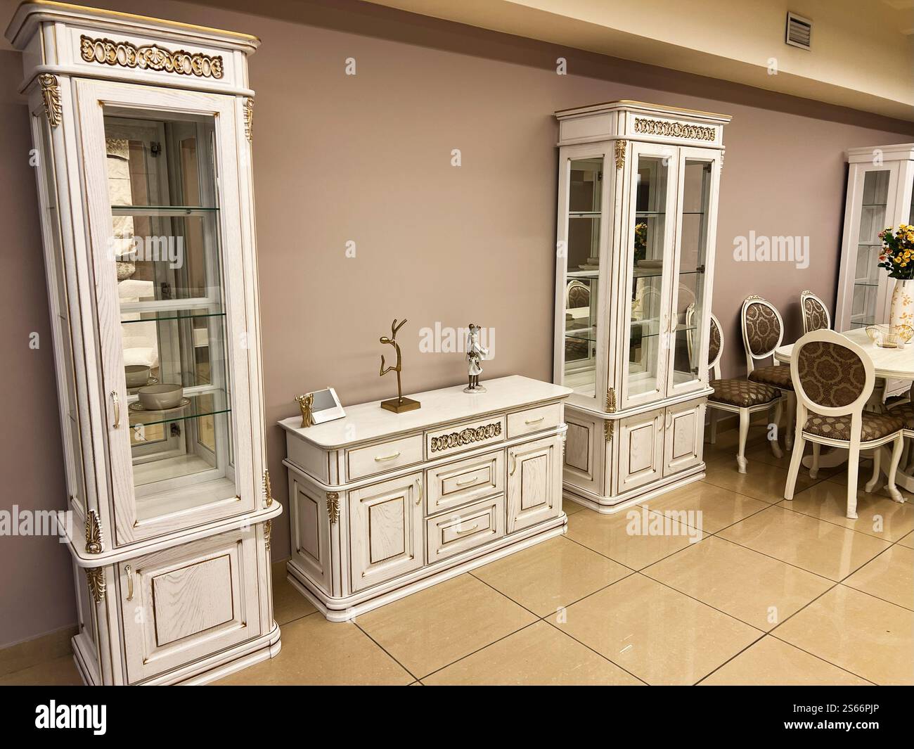 Classic living room showing wooden cabinets with glass display sections ...