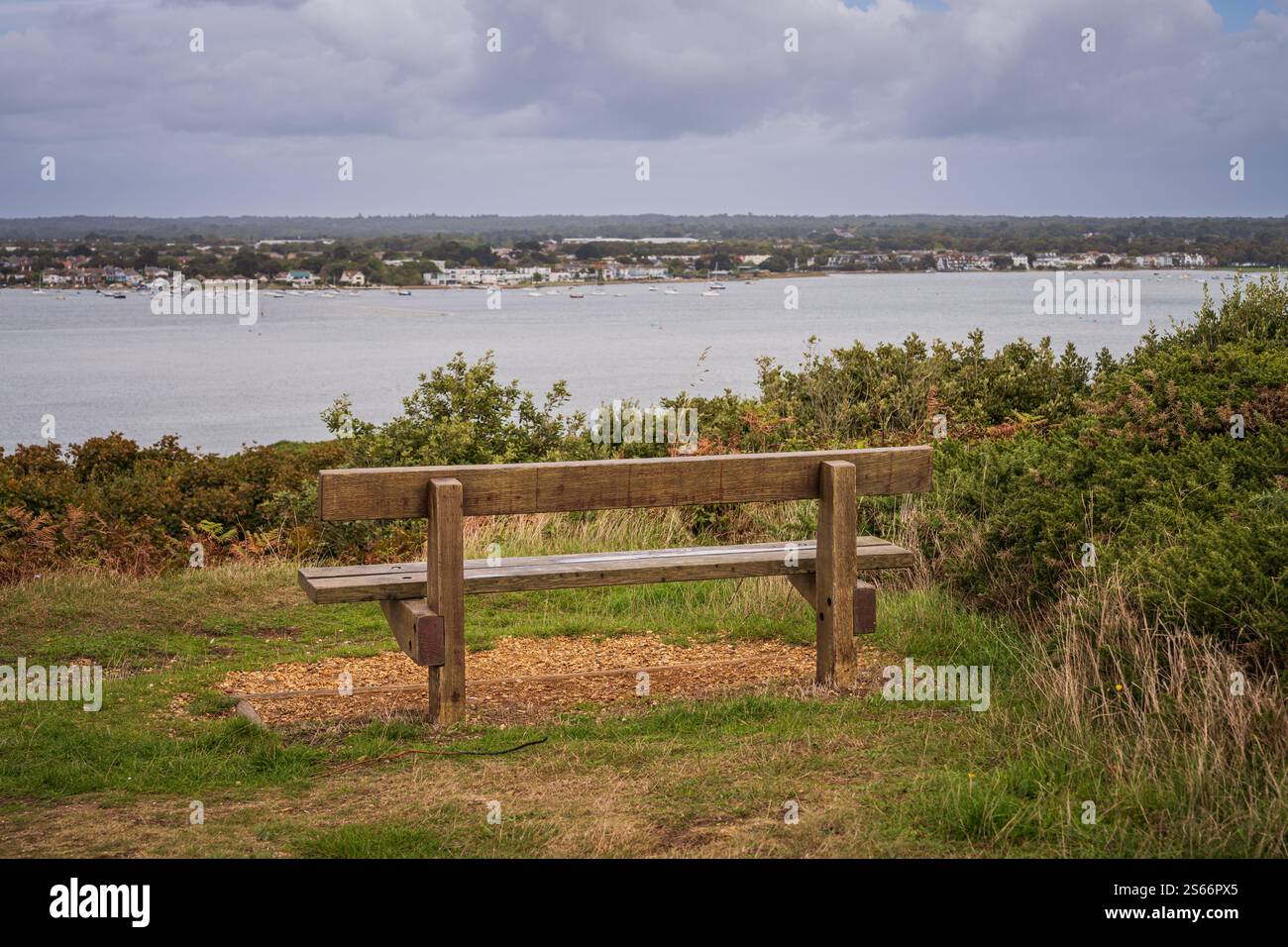 A bench overlooking Christchurch habour in Hengistbury Head, Dorset ...