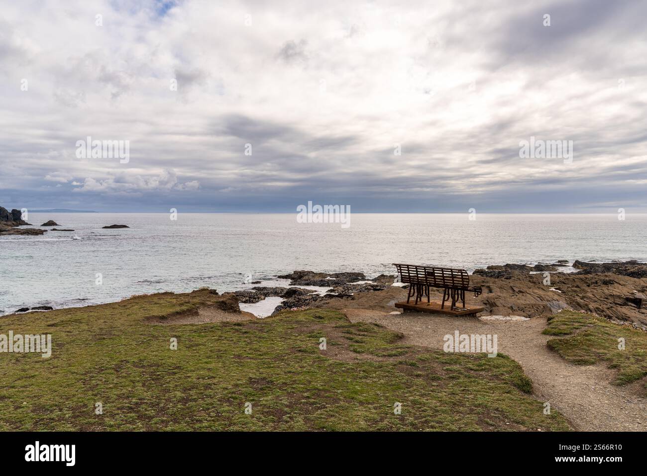 An old rusty bench in Treyarnon Bay, Cornwall, England, UK Stock Photo ...