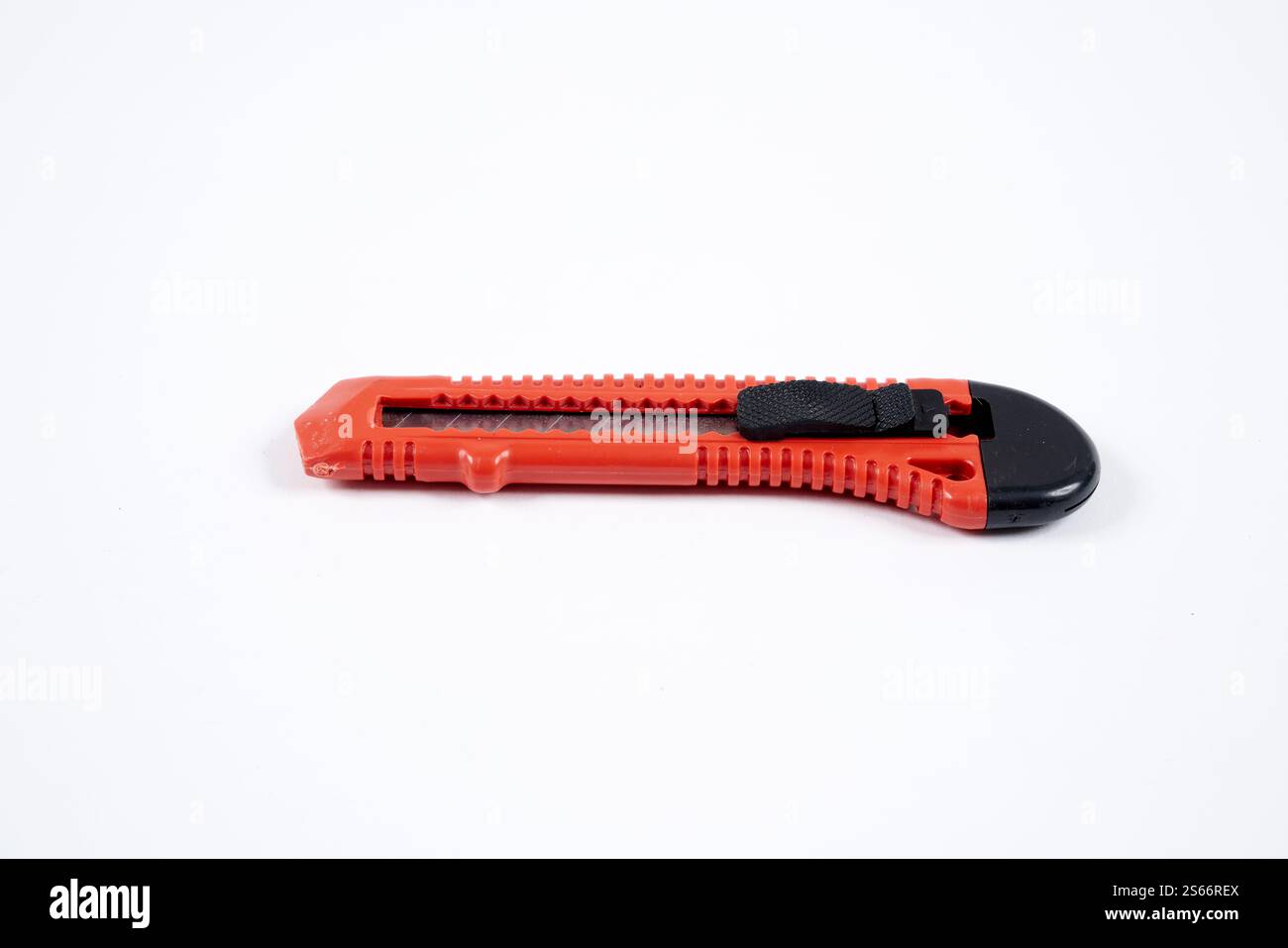 red utility knife on white background Stock Photo - Alamy