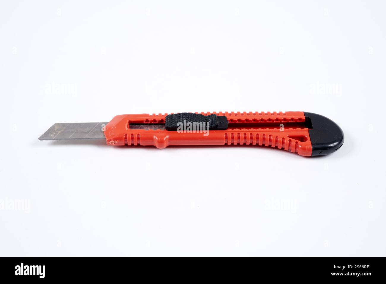 red utility knife on white background Stock Photo - Alamy