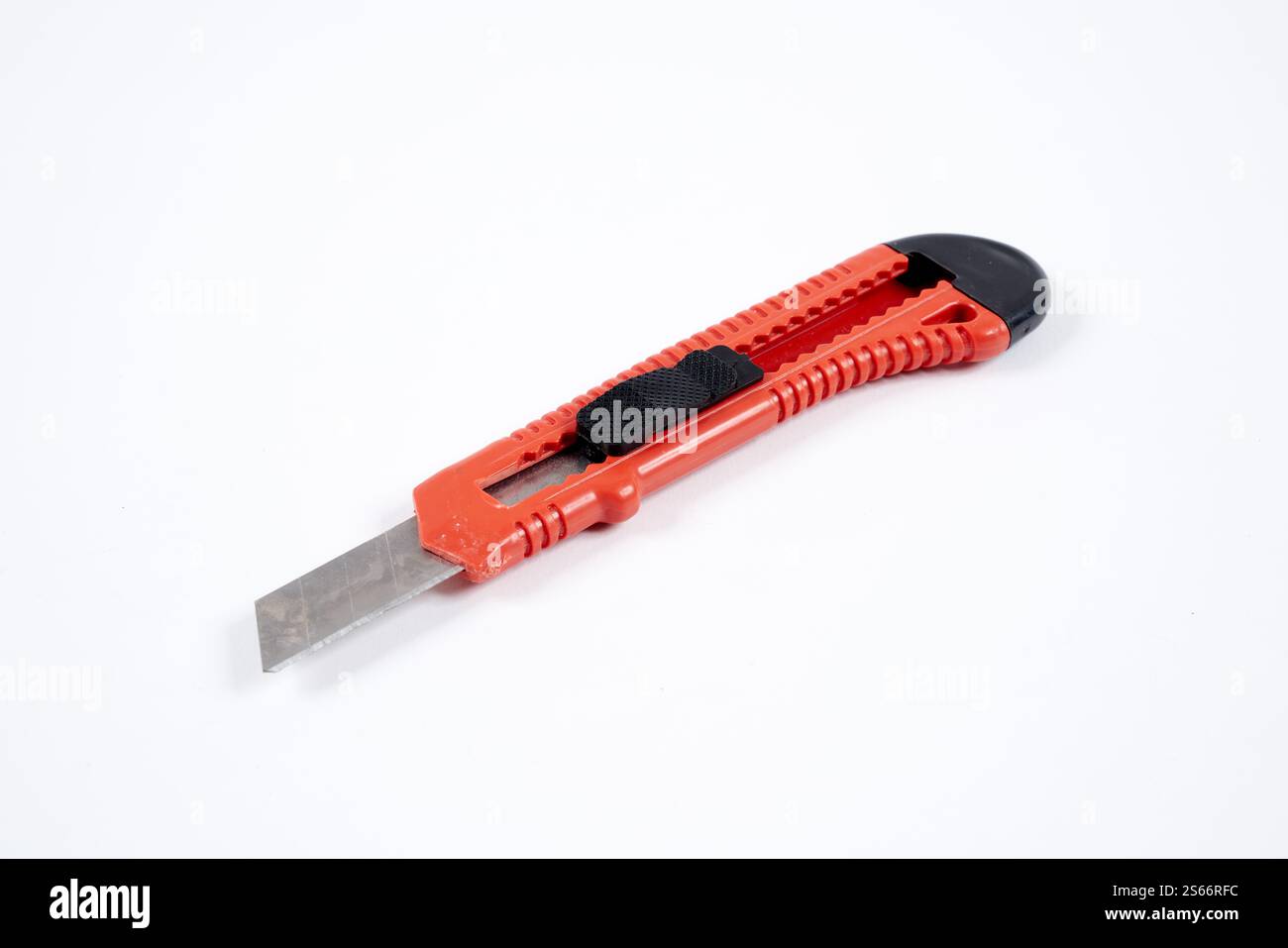 red utility knife on white background Stock Photo - Alamy