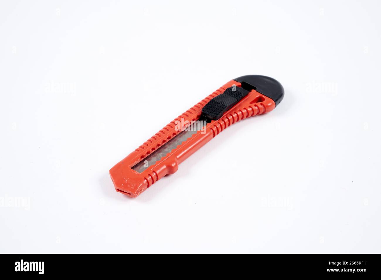 red utility knife on white background Stock Photo - Alamy