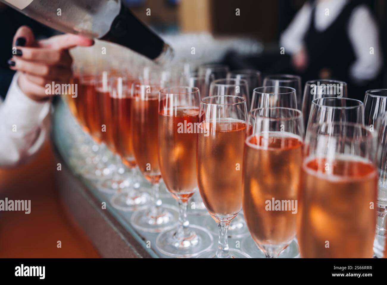 Alcohol setting on catering banquet table, bartender pouring liquor ...