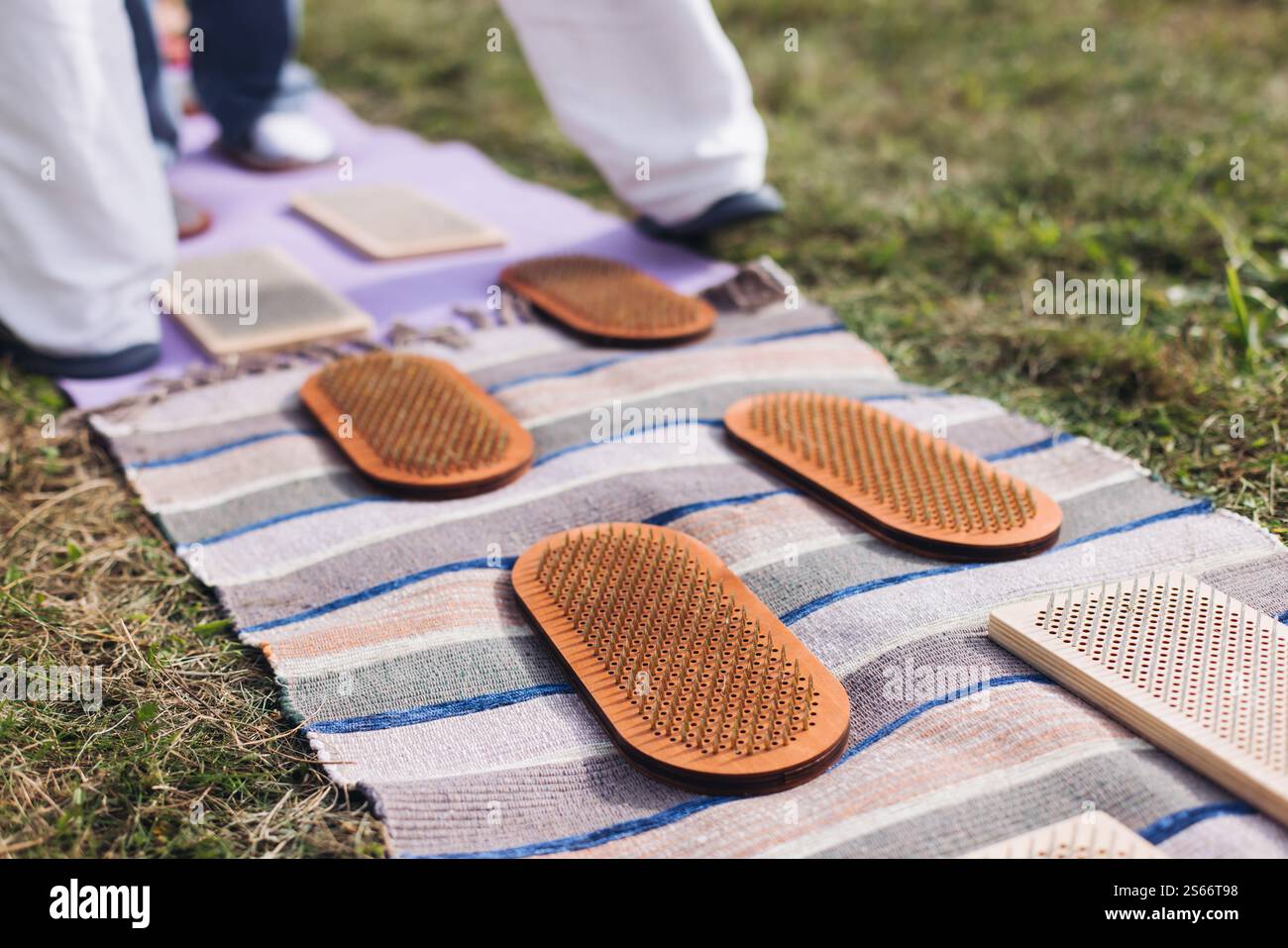 Standing on sadhu board, process of barefoot standing on nails therapy ...