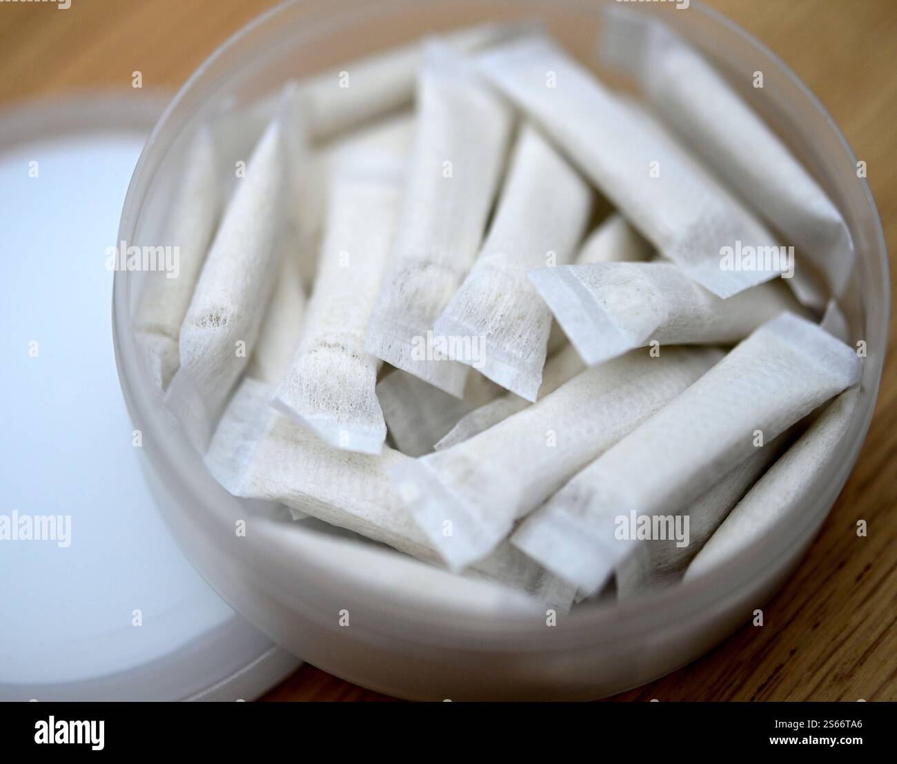 Illustration on the subject of nicotine pouches. In the picture: A can ...