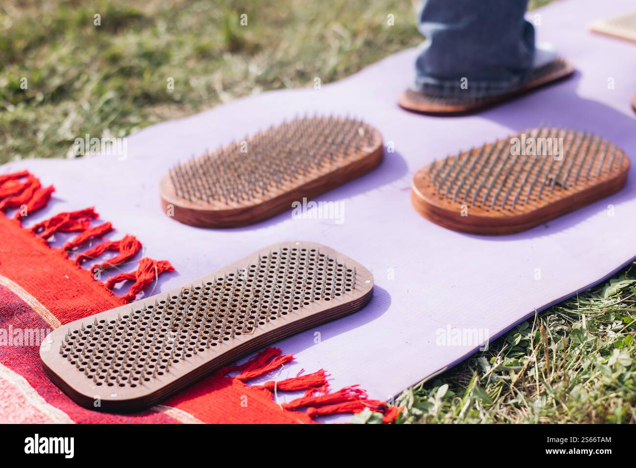 Standing on sadhu board, process of barefoot standing on nails therapy ...