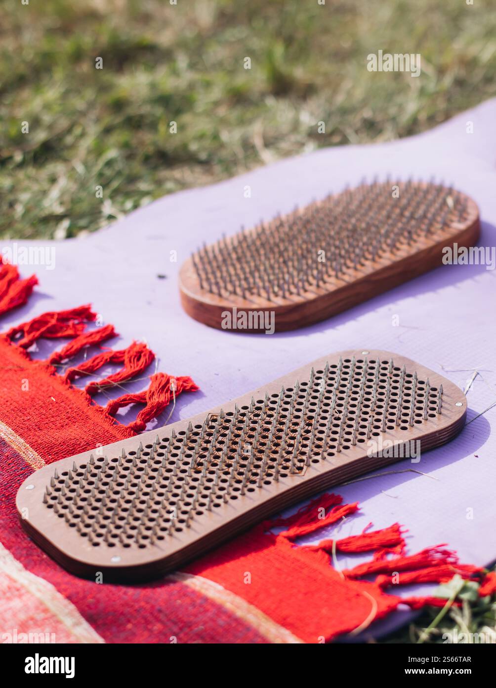 Standing on sadhu board, process of barefoot standing on nails therapy ...