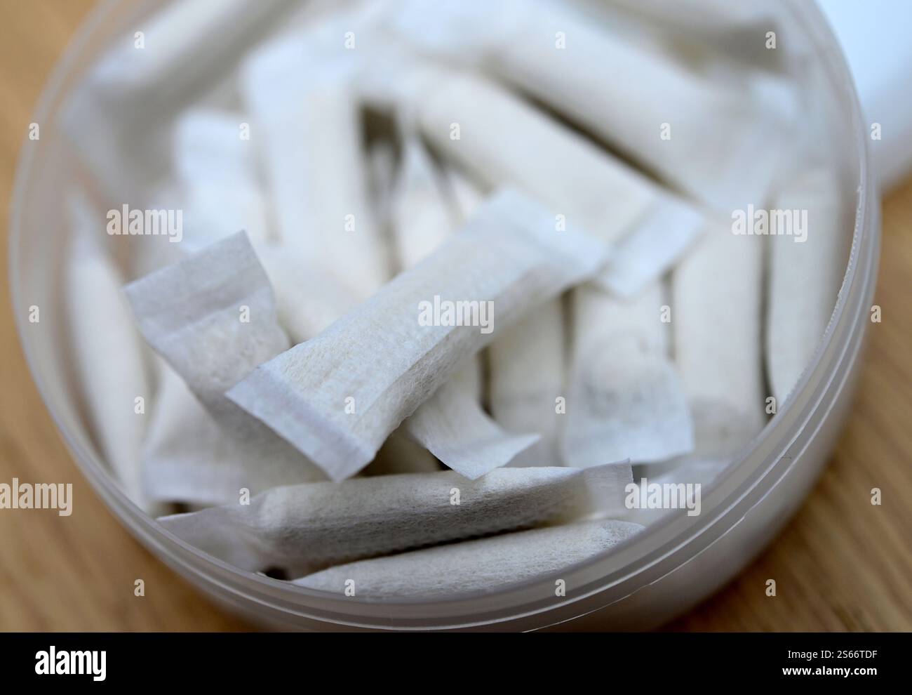 Illustration on the subject of nicotine pouches. In the picture: A can ...