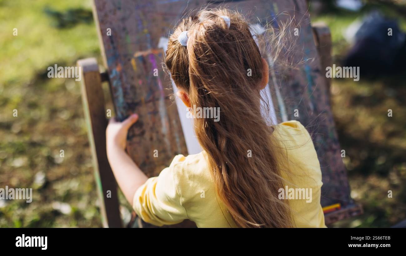 Kids drawing at plein air, group class of talented children with ...