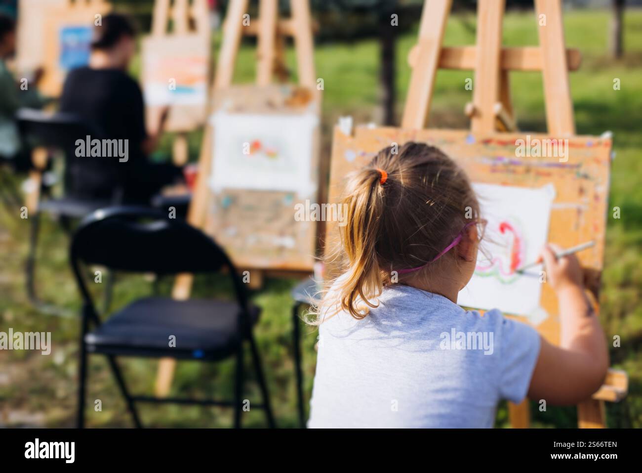 Kids drawing at plein air, group class of talented children with ...