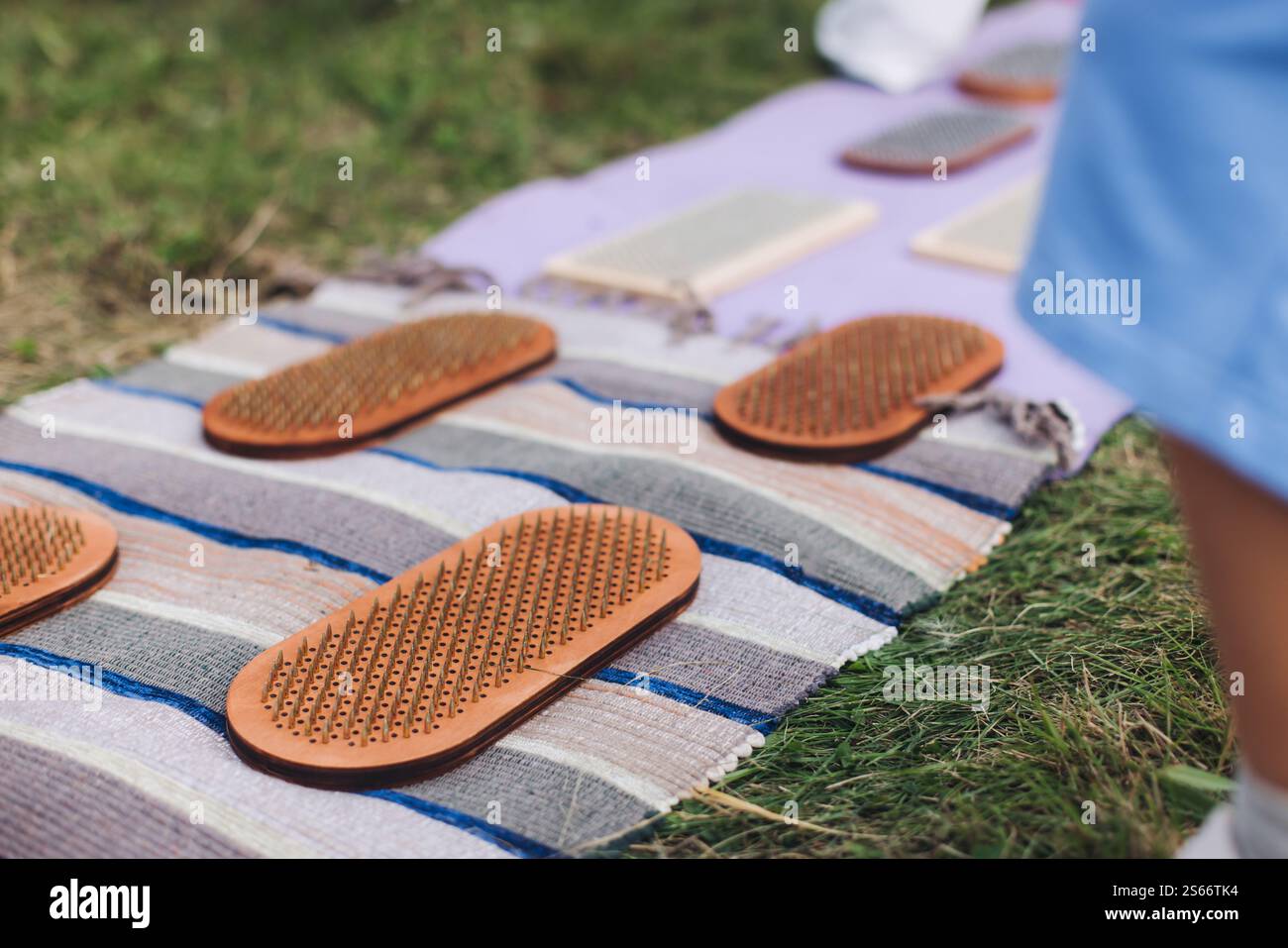 Standing on sadhu board, process of barefoot standing on nails therapy ...