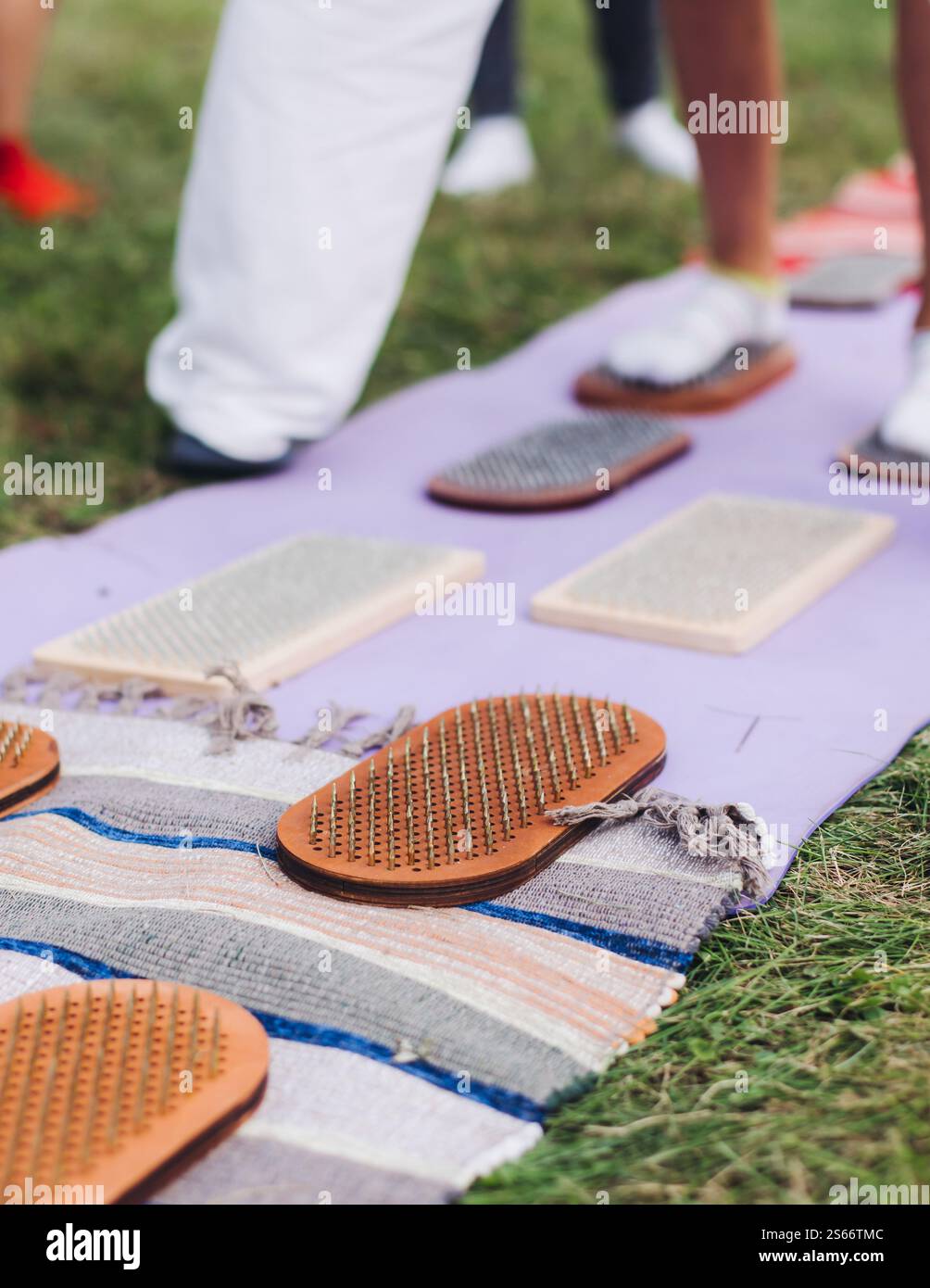 Standing on sadhu board, process of barefoot standing on nails therapy ...