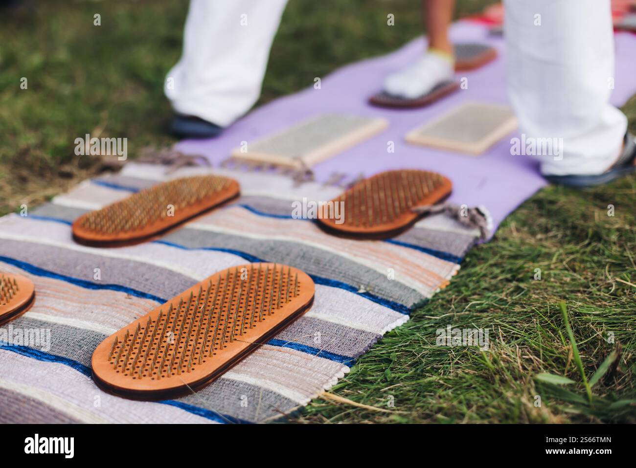 Standing on sadhu board, process of barefoot standing on nails therapy ...