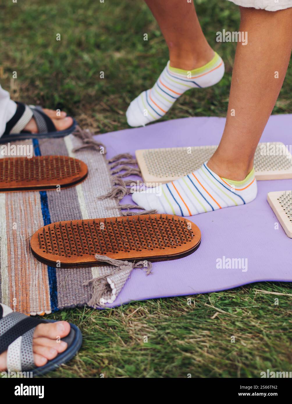 Standing on sadhu board, process of barefoot standing on nails therapy ...