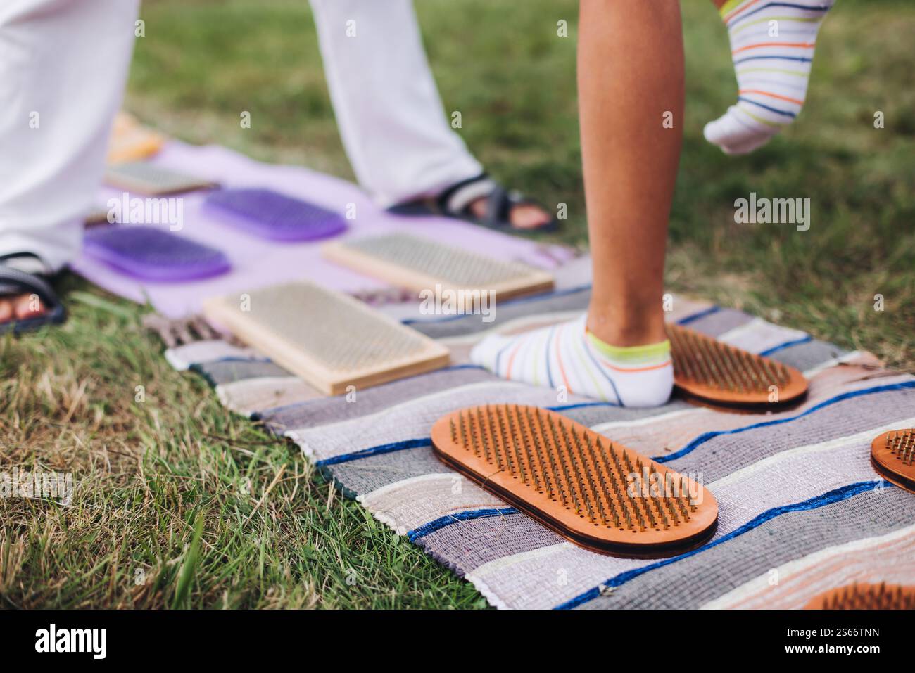 Standing on sadhu board, process of barefoot standing on nails therapy ...